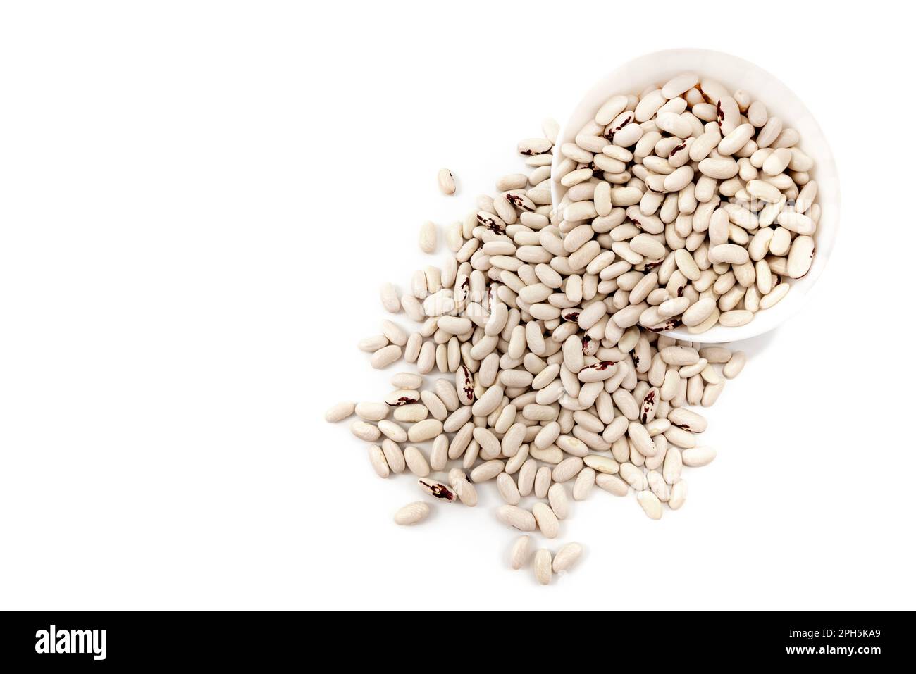 Bean grains poured out of a plate on a white background. Bean isolate ...