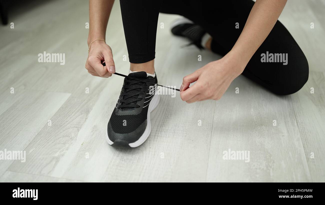 Portrait woman tying shoelace workout hi-res stock photography and ...