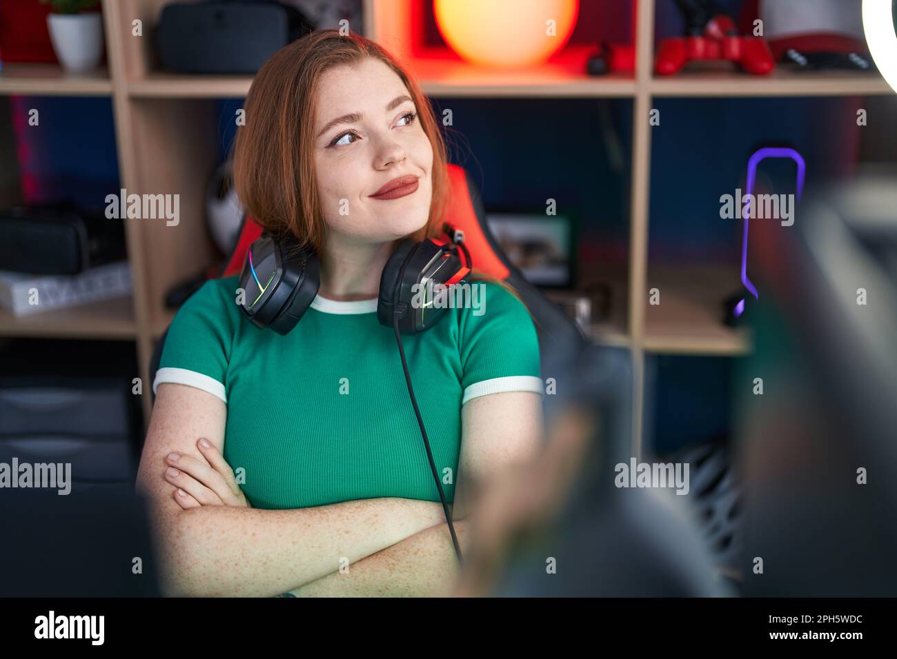 Young redhead woman streamer smiling confident sitting with arms ...