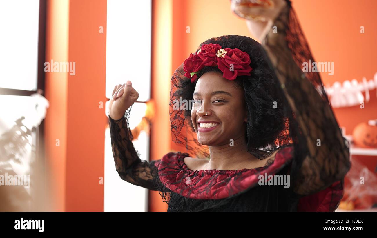 African american woman wearing katrina costume having halloween party ...
