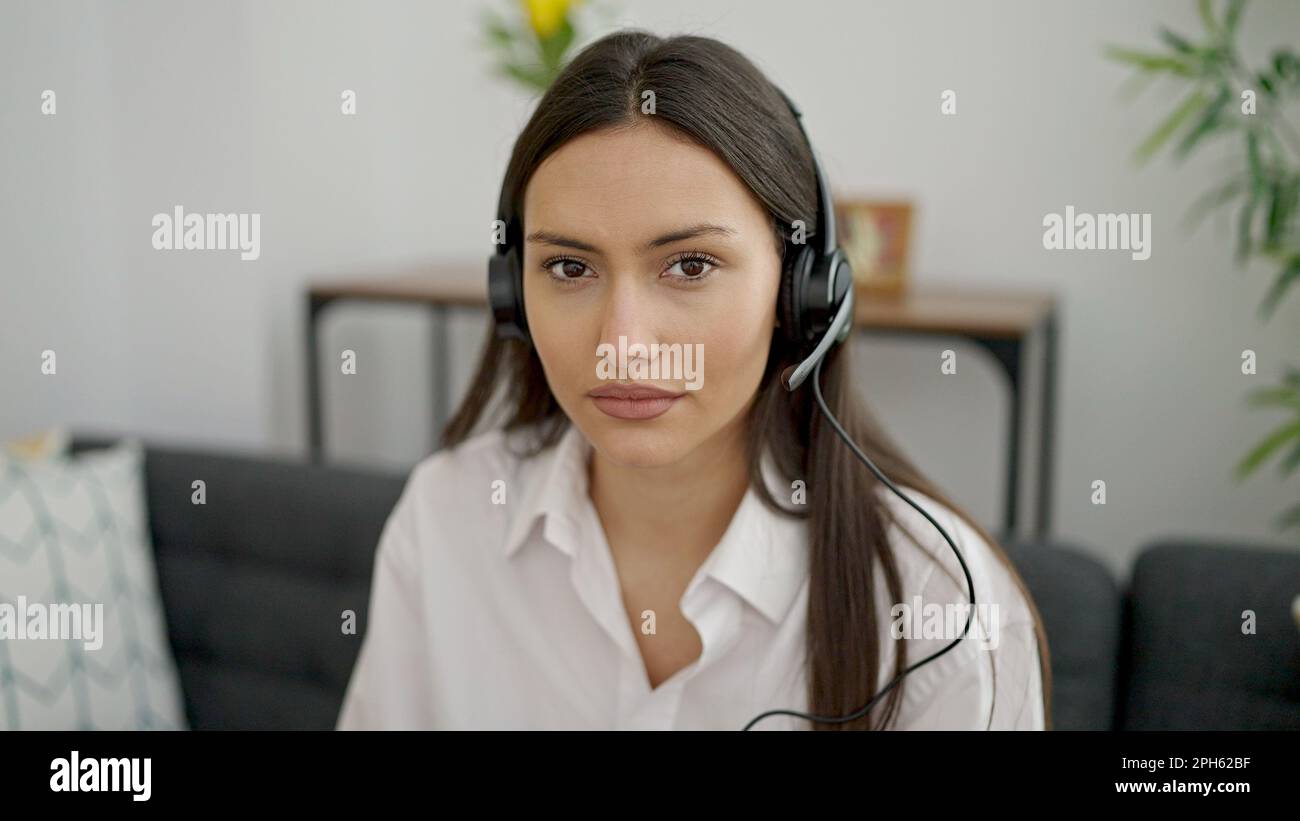 Young beautiful hispanic woman call center agent working at home Stock ...