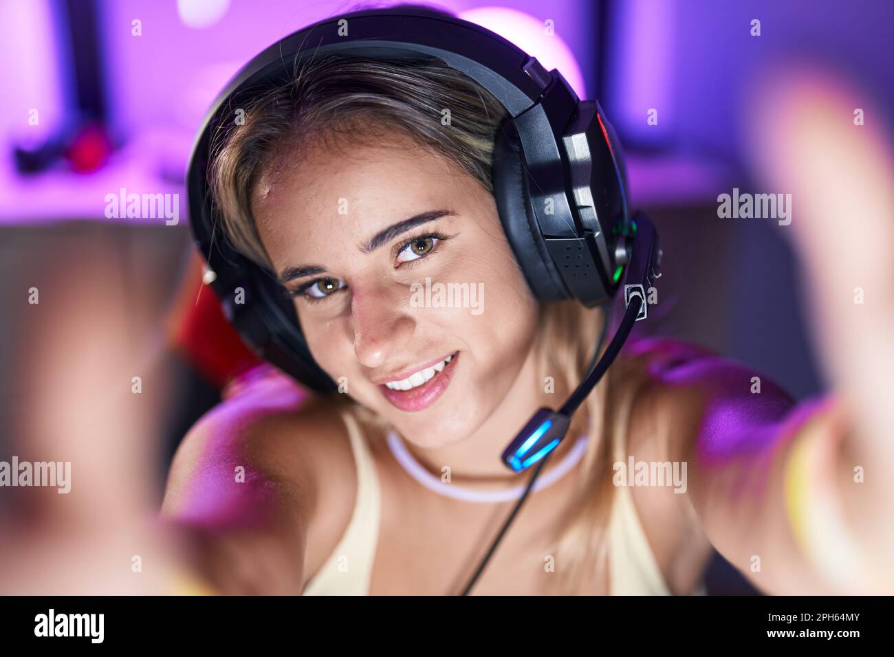 Young blonde woman streamer smiling confident make selfie by camera at ...