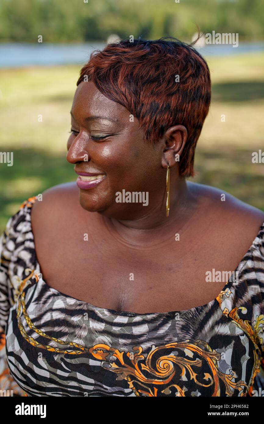 Closeup portrait of a beautiful plus size female model posing in a ...