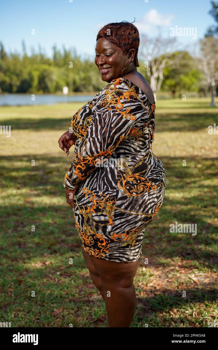 Plus size woman modeling dress hi-res stock photography and images - Alamy
