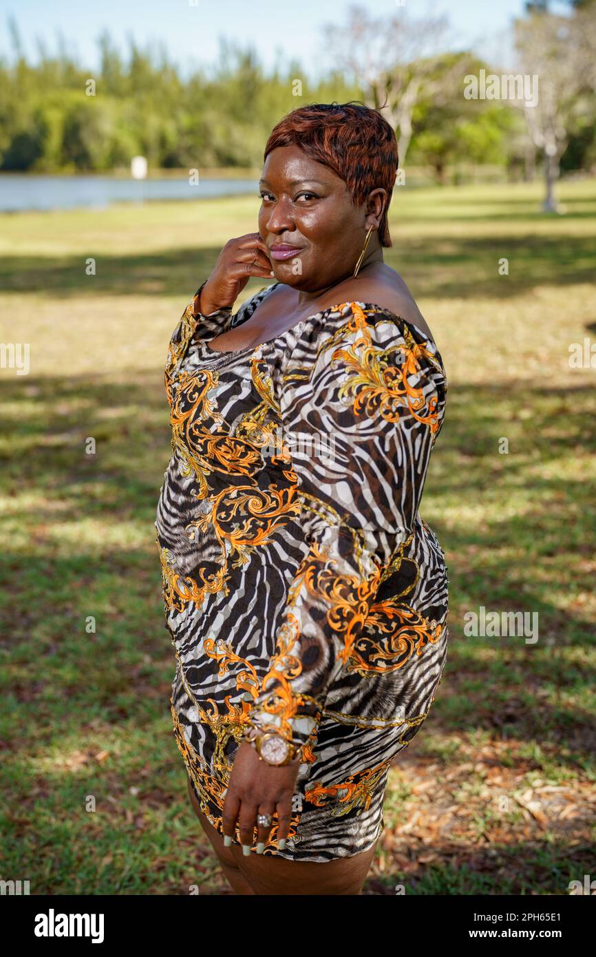 Plus size woman modeling dress hi-res stock photography and images - Alamy