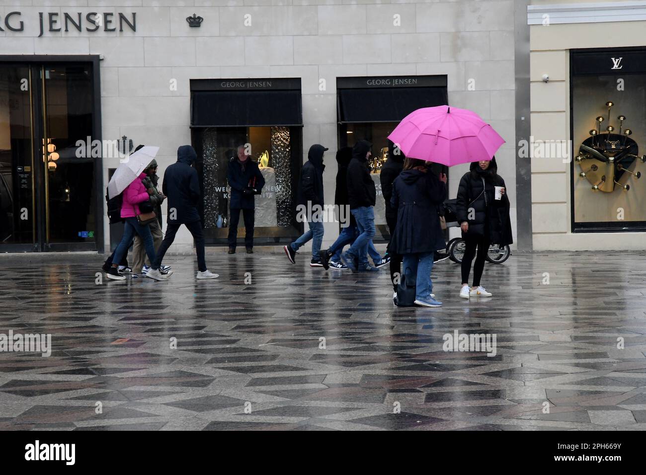 Copenhagen /Denmark/26 March 2023/People use umbrella duering rain fall ...