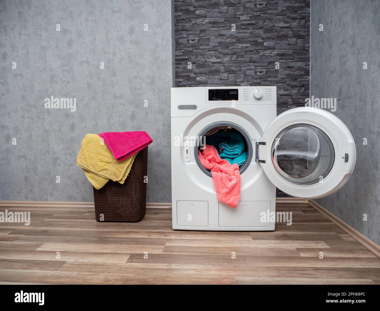 Laundry room interior with washing machine against the wall. Modern ...