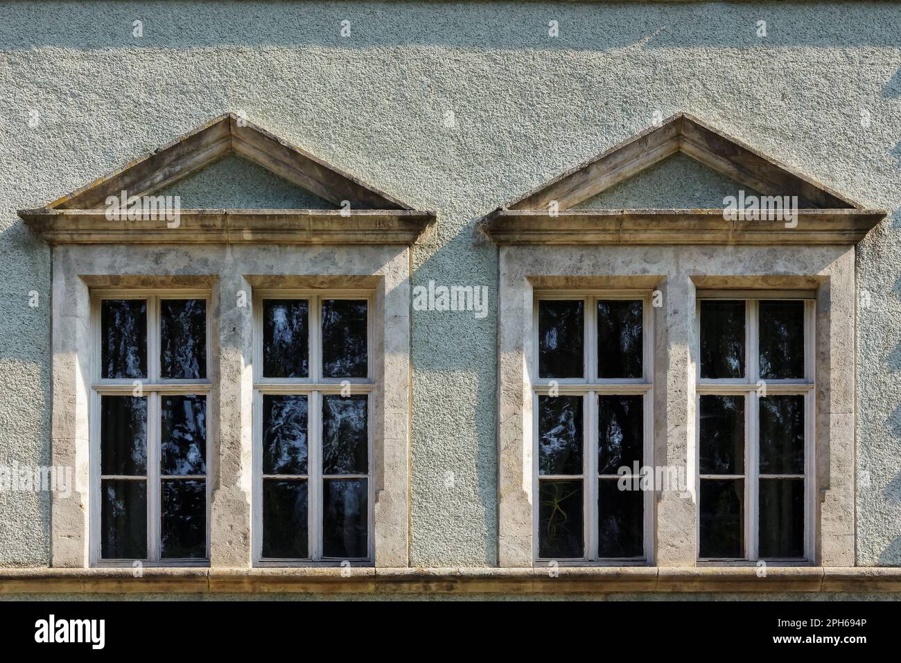 ancient windows on the vintage wall. antique architectural element in ...