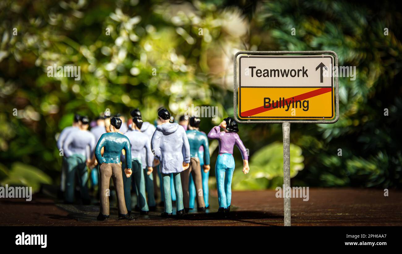 Street Sign the Direction Way to Teamwork versus Bullying Stock Photo ...