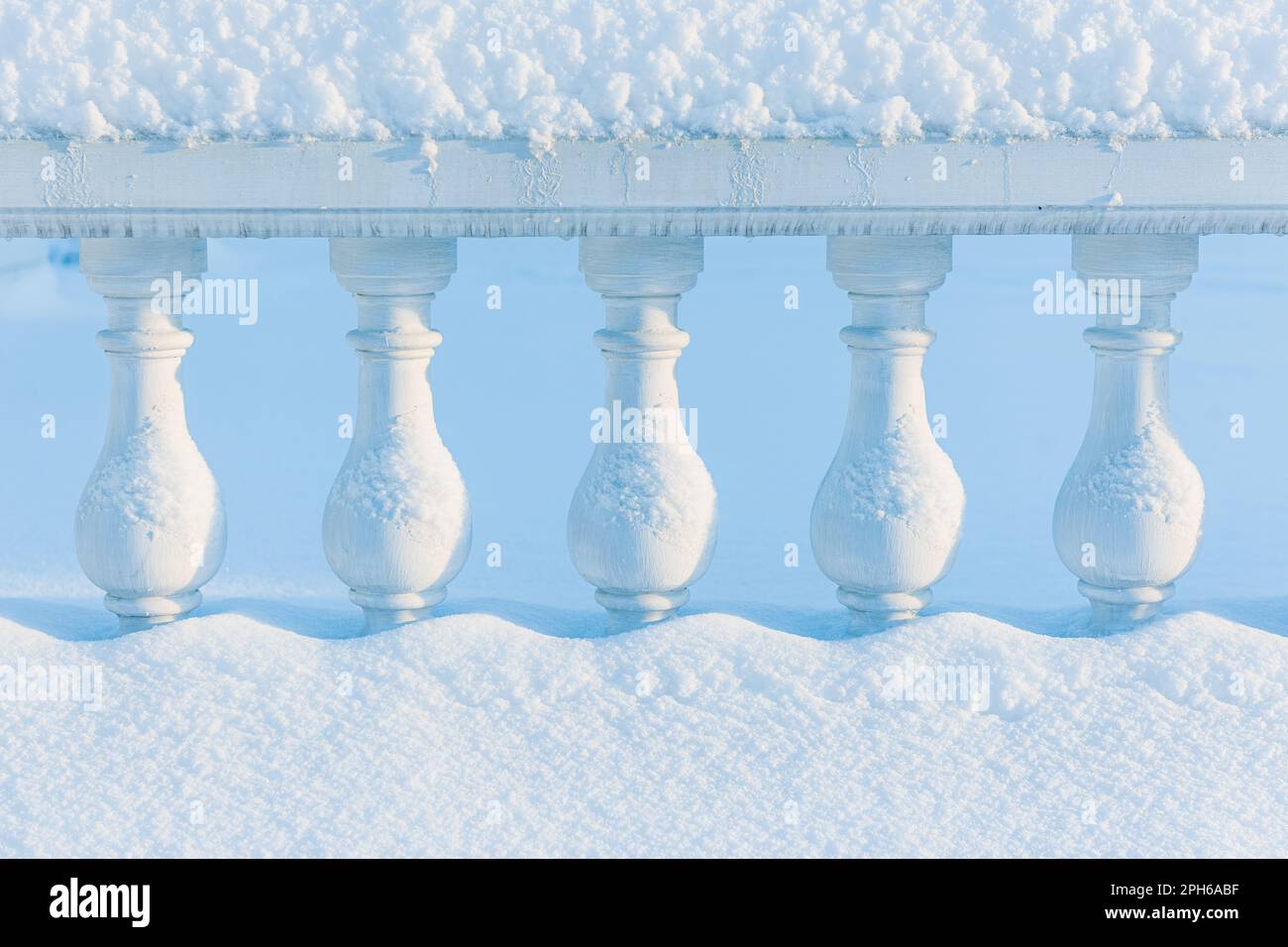 White pillars standing amongst the wintery scene at Gunnebo Castle ...