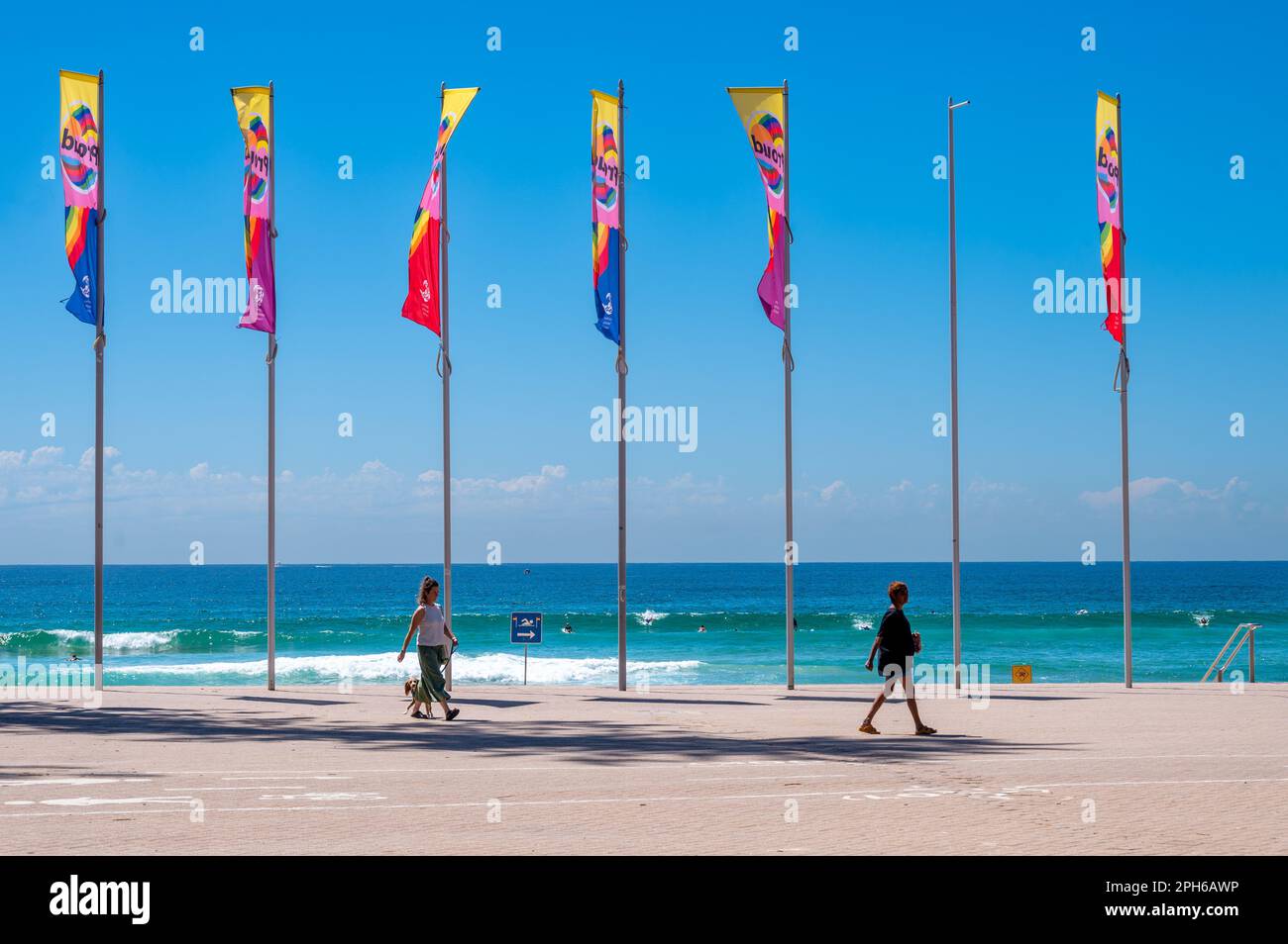 Colourfull flags fly over walkers on Manly Promenade, Sydney, New South ...