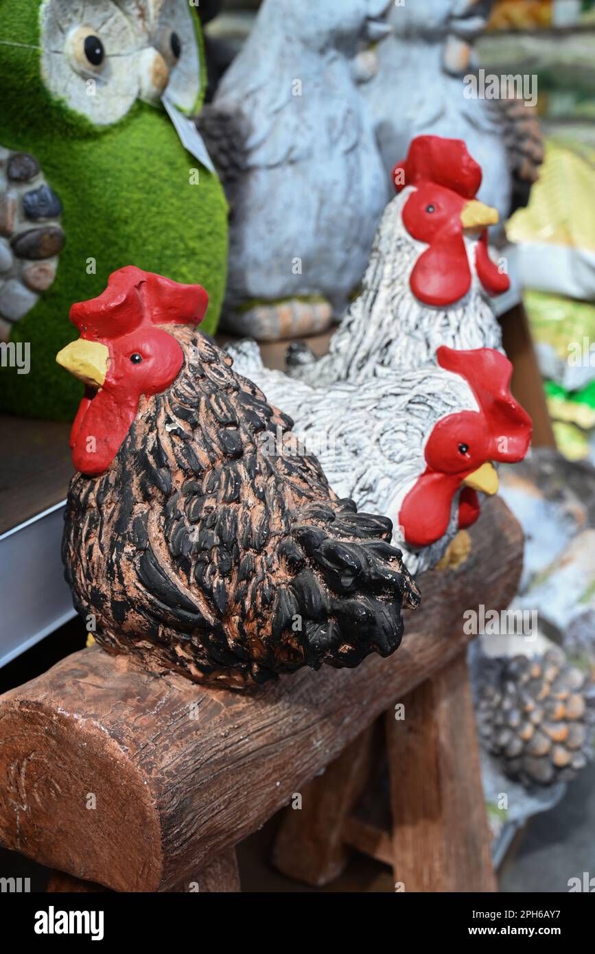 Clay figurine of a chicken on different backgrounds. Handmade clay ...