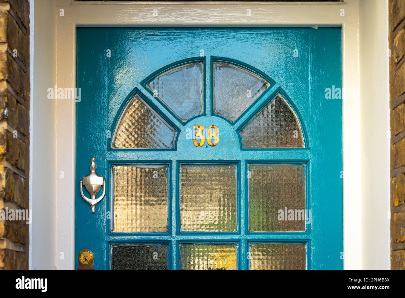 House number 38 in blue with glass panels Stock Photo - Alamy