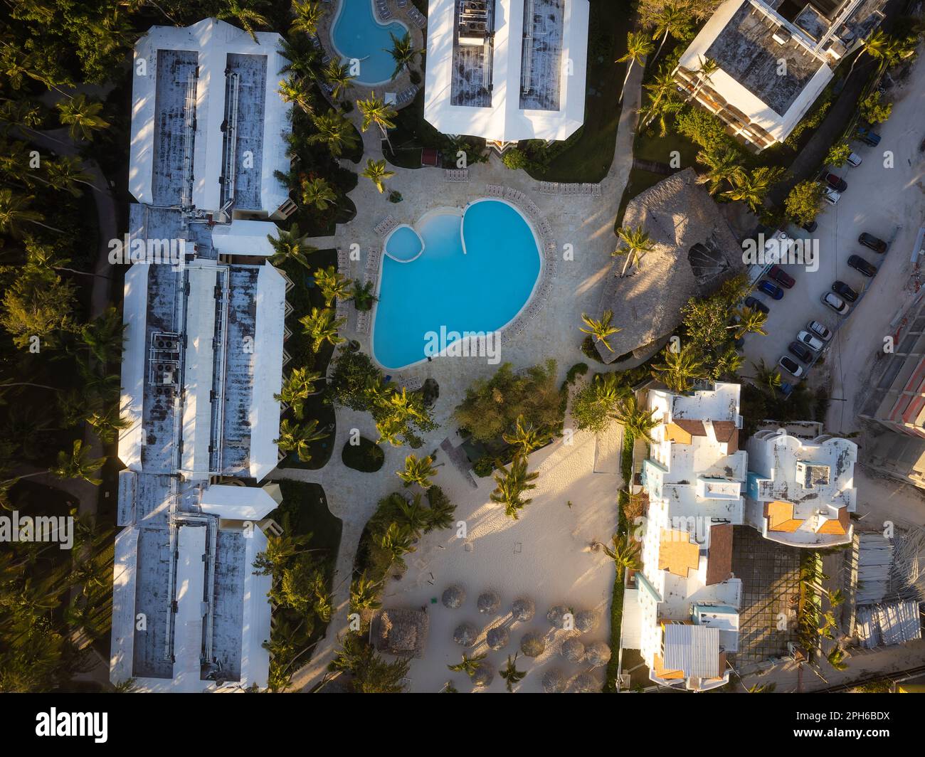 Tropical resort town. View from above. Lots of tropical plants, car ...