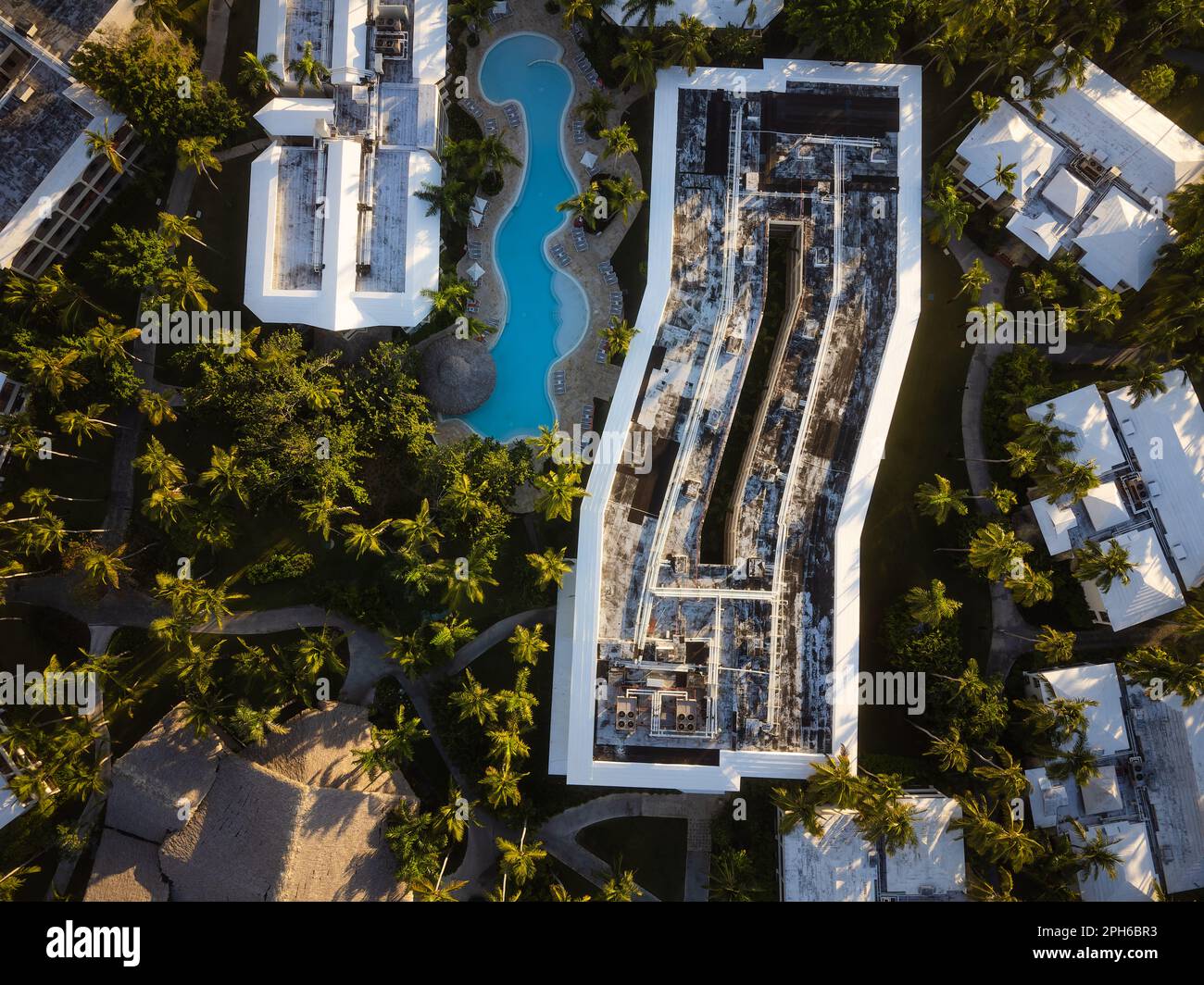 Resort complex. Aerial view. Lots of tropical plants, a big blue pool ...