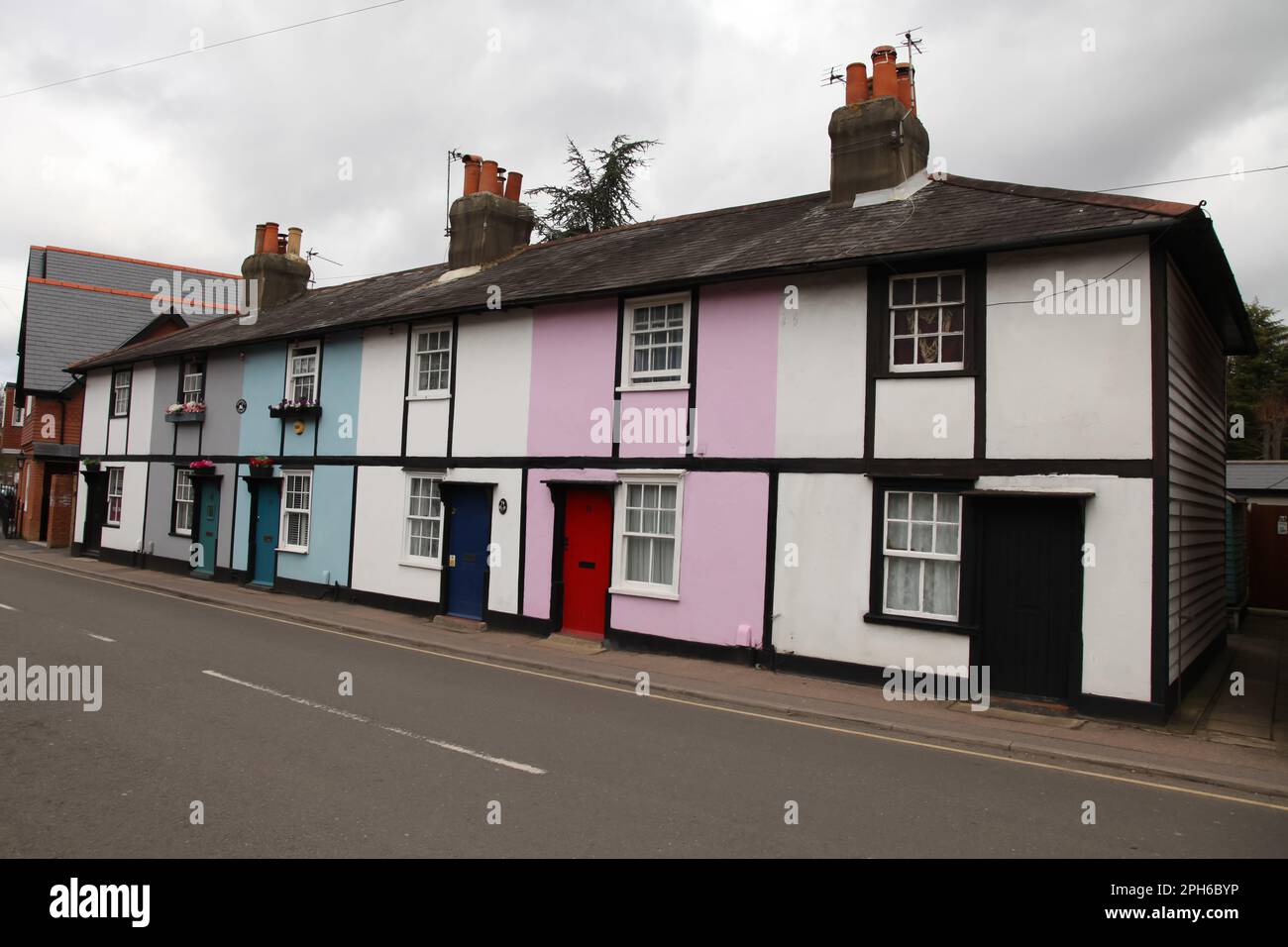 The colourful Woodfield Lane cottages in Ashtead, Surrey, England, UK ...