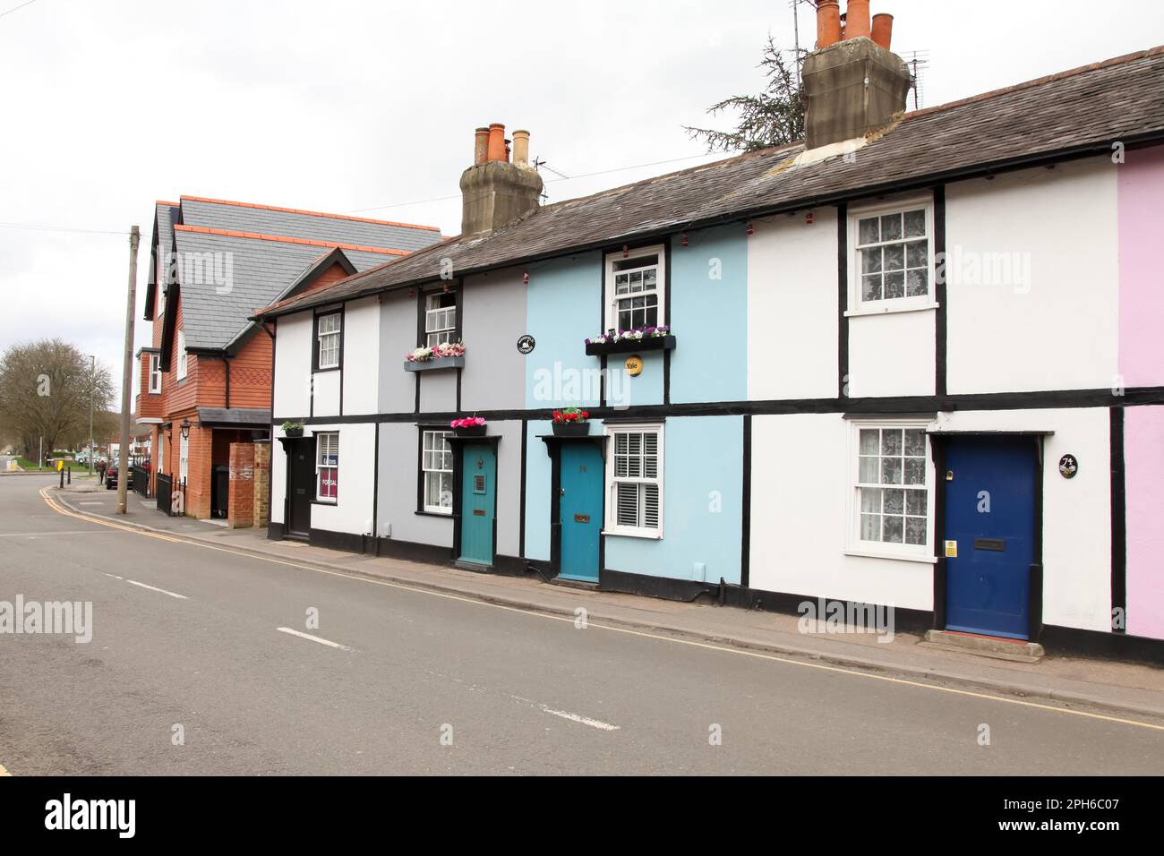 The colourful Woodfield Lane cottages in Ashtead, Surrey, England, UK ...