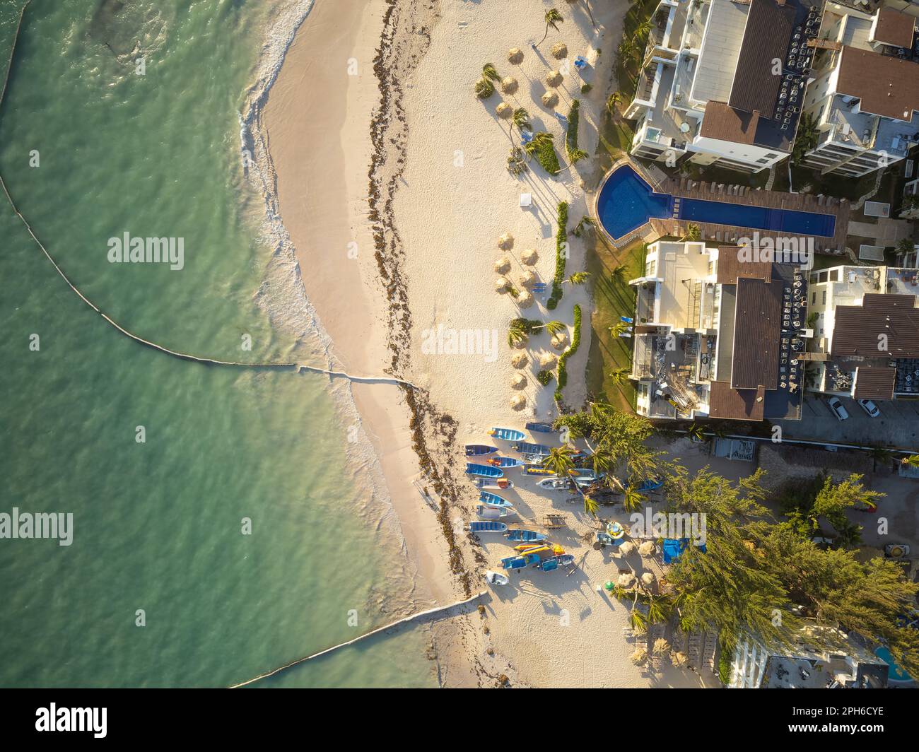 Lots of boats on the beach. Seaside resort. Beautiful tall hotels among ...