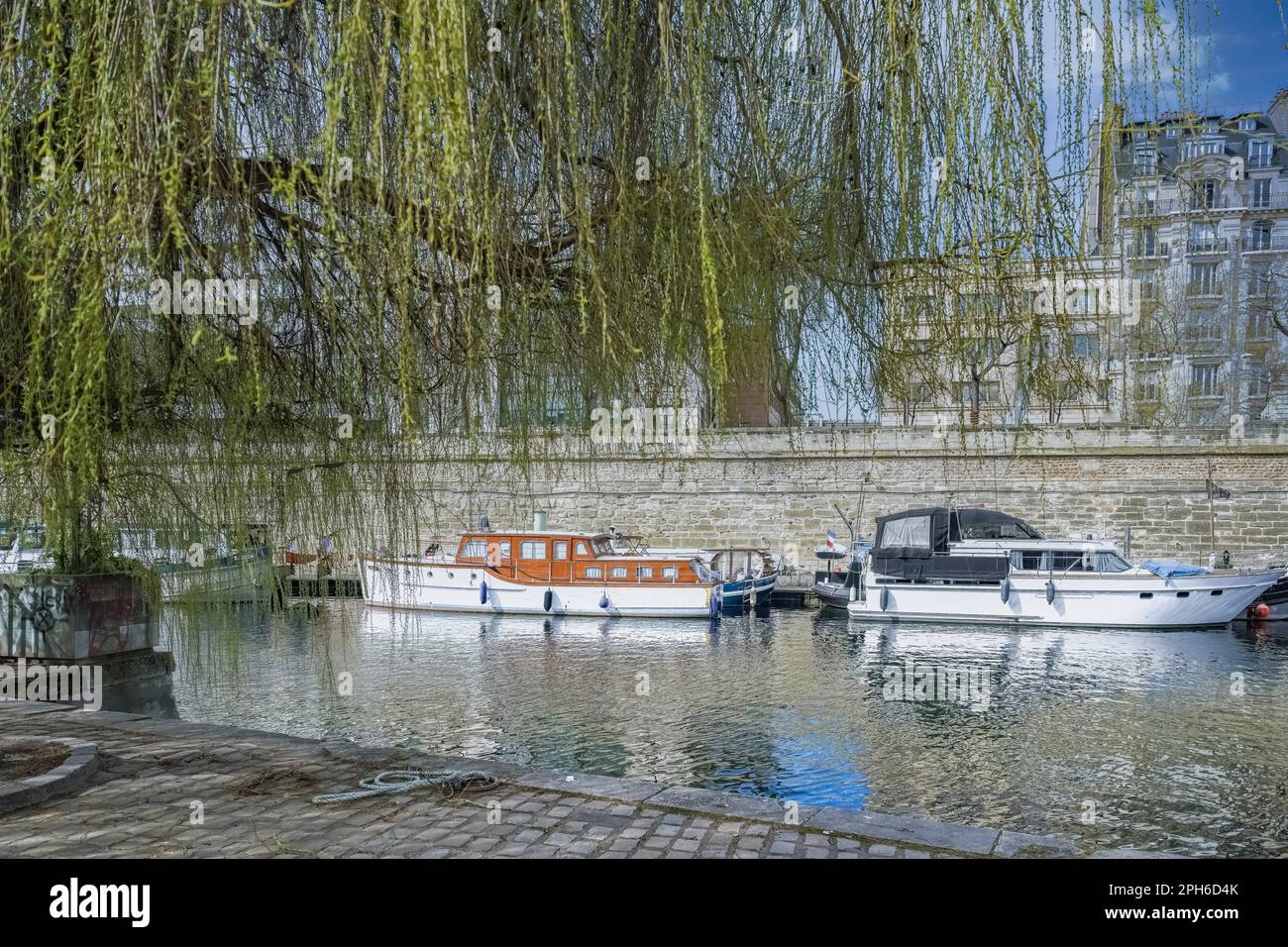 Paris, Bastille, beautiful harbor with houseboats, and typical facade ...