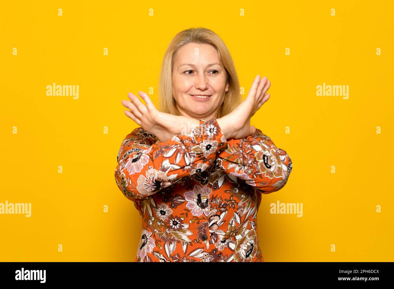 Stop don't move, Portrait of blonde caucasian woman cross hands x sign ...