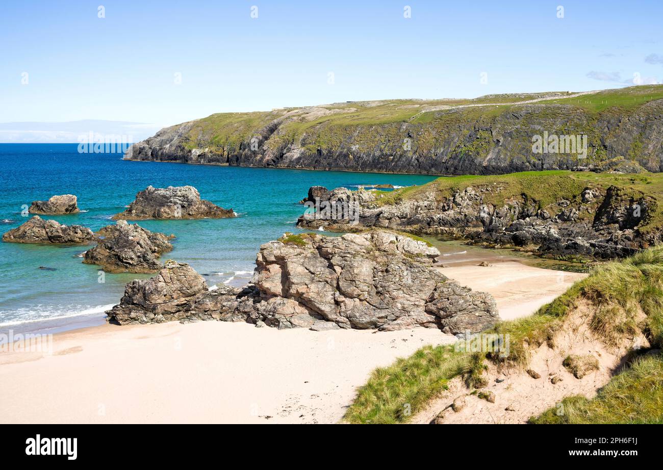 Rock outcrops at the end of Sangomore Beach, Durness, Sutherland, with ...