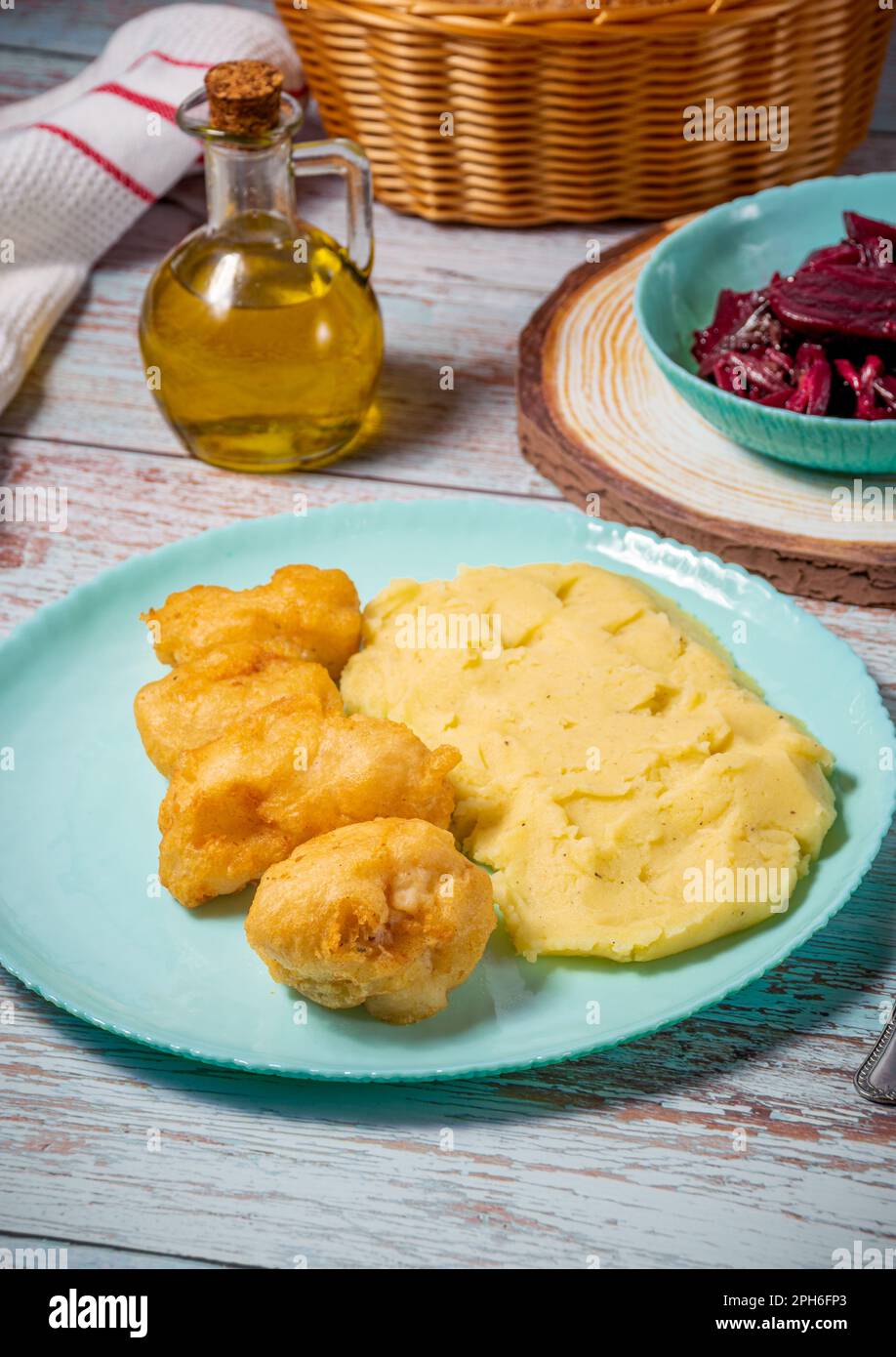 Cod fish with a potato garlic mash - Bakaliaros Skordalia Stock Photo ...