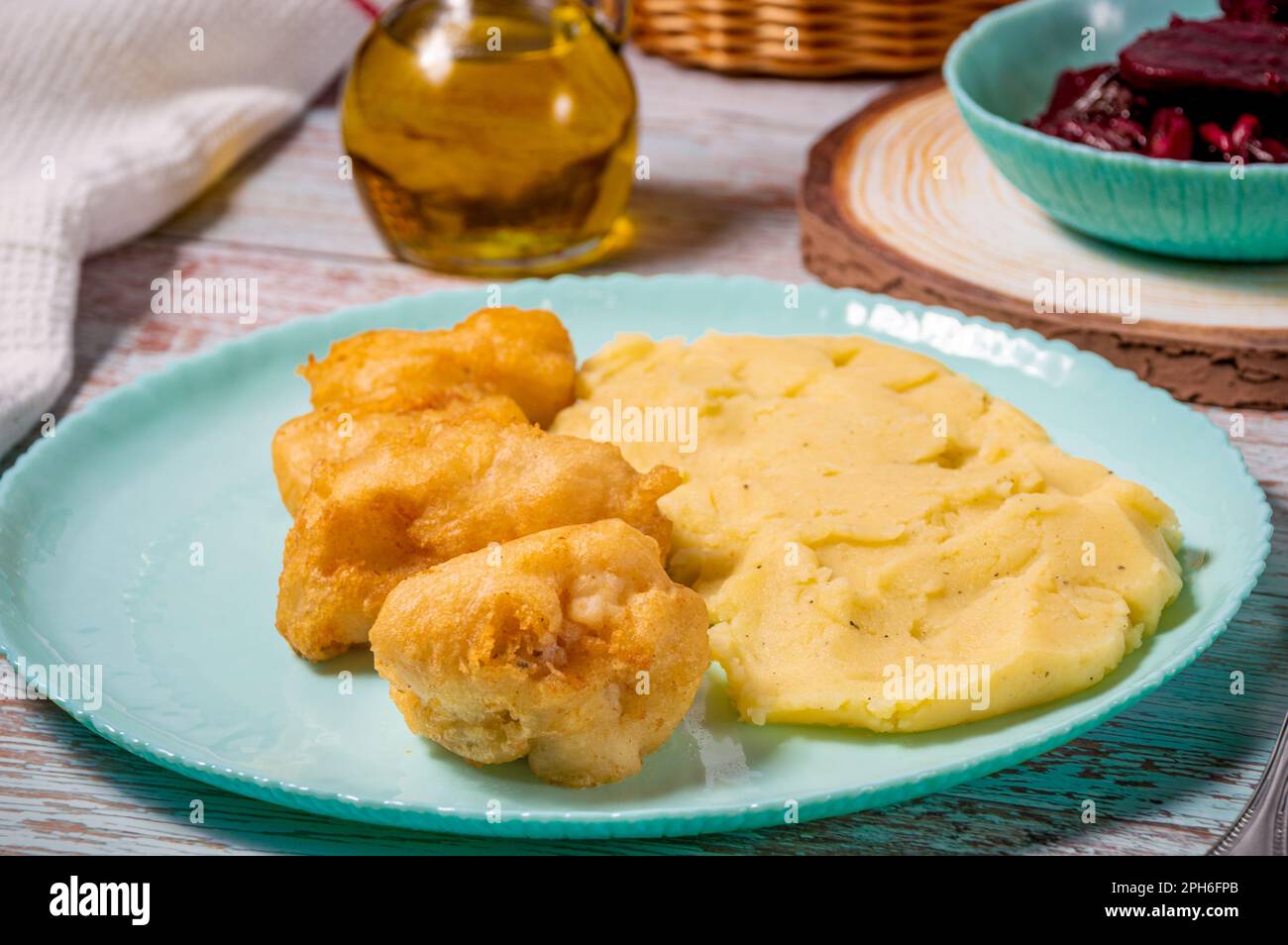 Cod fish with a potato garlic mash - Bakaliaros Skordalia Stock Photo ...