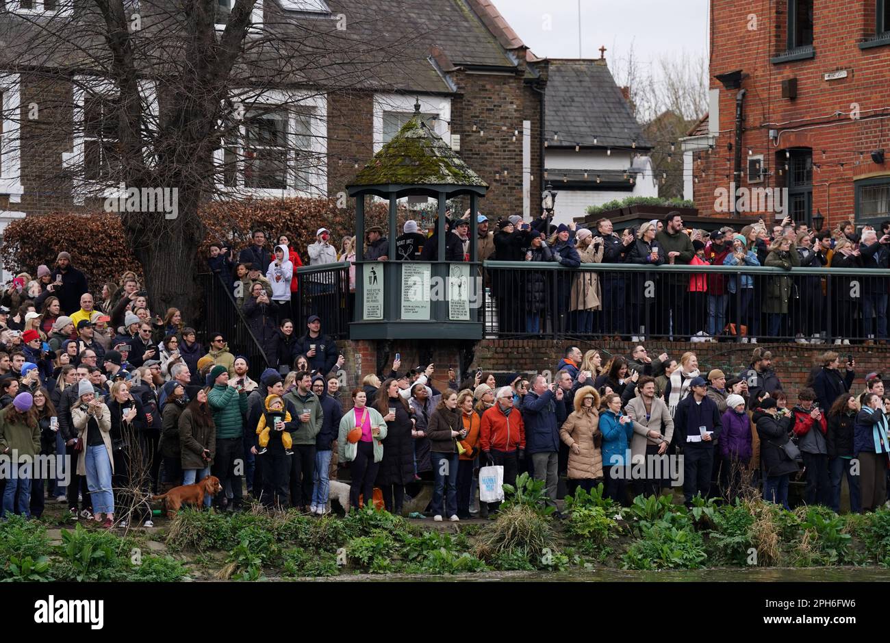 Spectators watch the men's race from the riverbank during the 168th Men ...