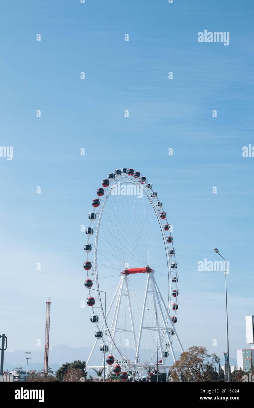 Ferris wheel in Antalya, Turkey. Vertical photo Stock Photo - Alamy