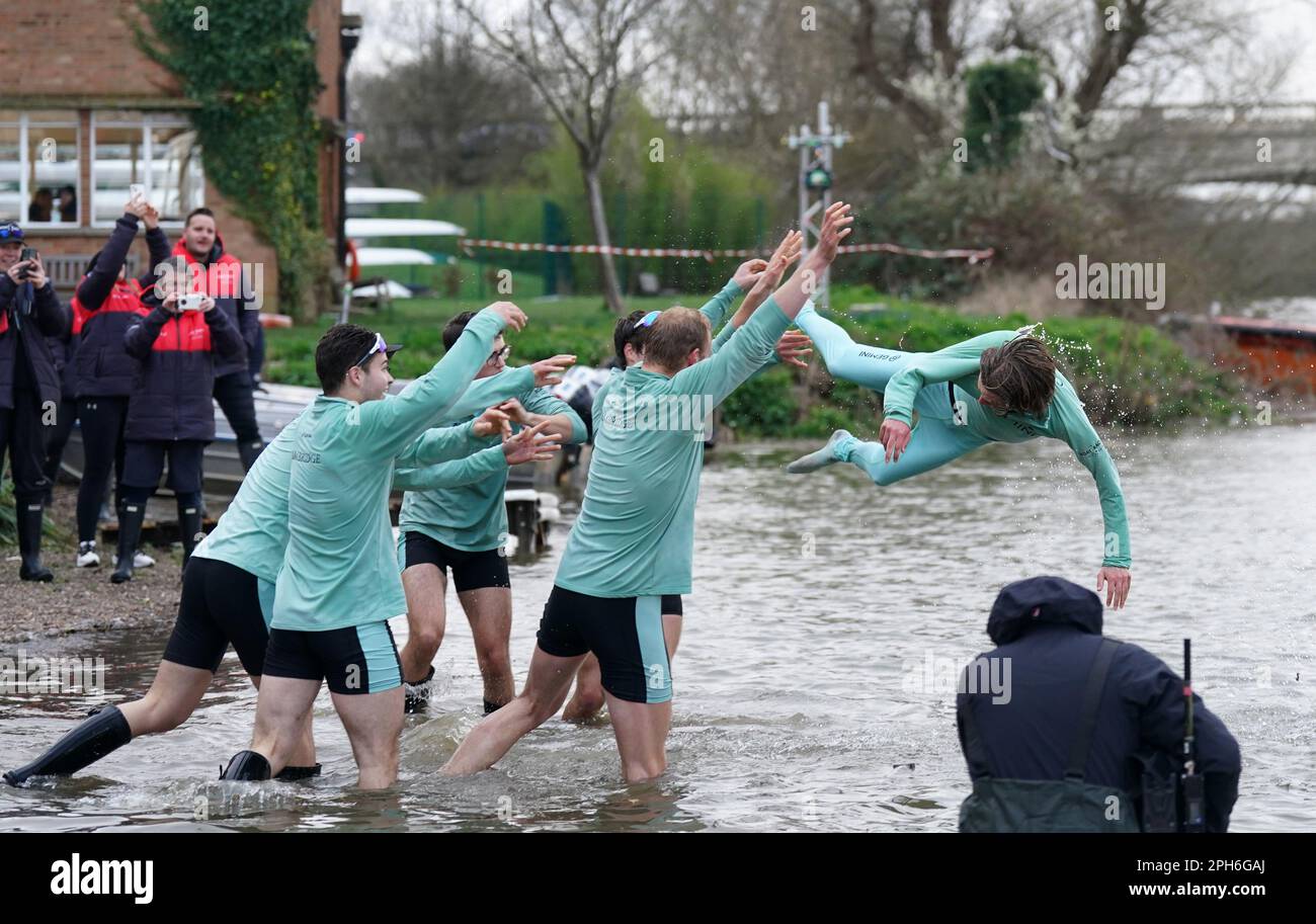 Cambridge men's cox Jasper Parish is thrown into the river after the ...