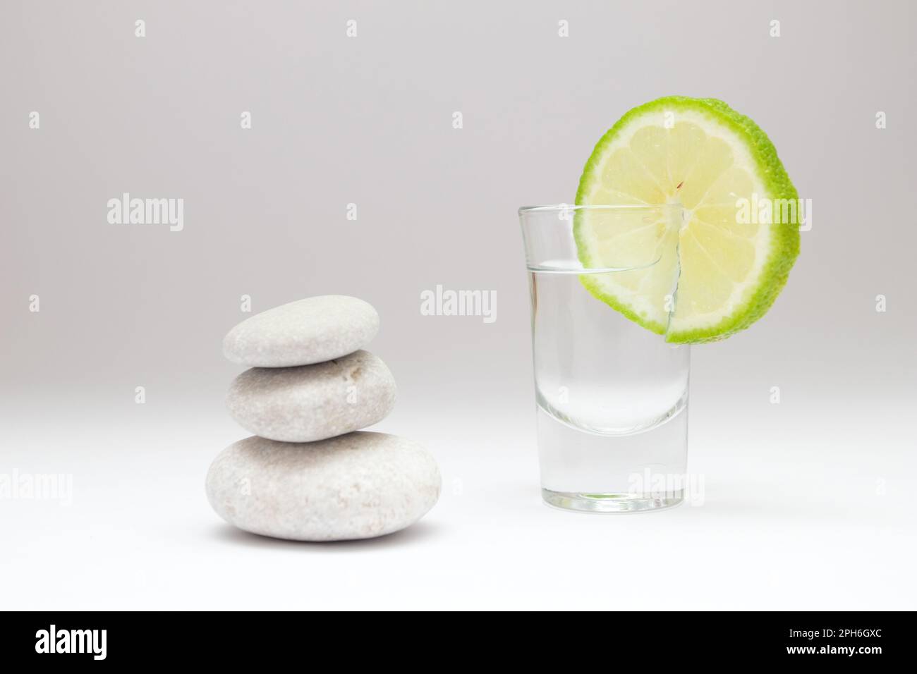 Shot of tequila and stone pyramid Stock Photo - Alamy