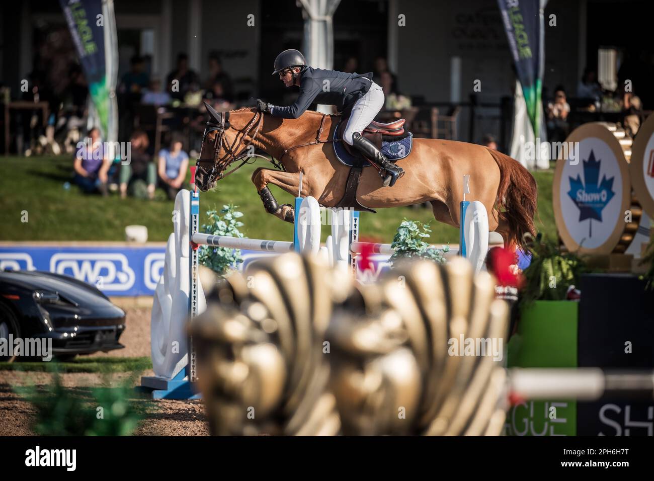 A professional rider competes during the 2022 Major League Show Jumping ...