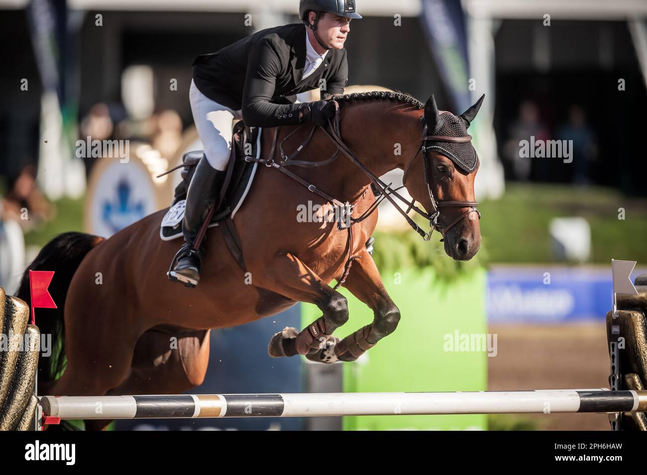 A professional rider competes during the 2022 Major League Show Jumping ...
