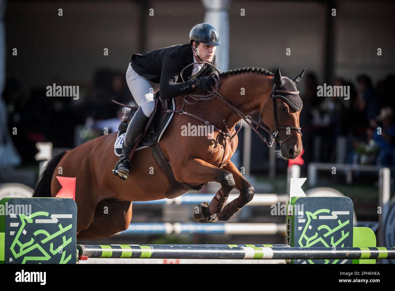 A professional rider competes during the 2022 Major League Show Jumping ...