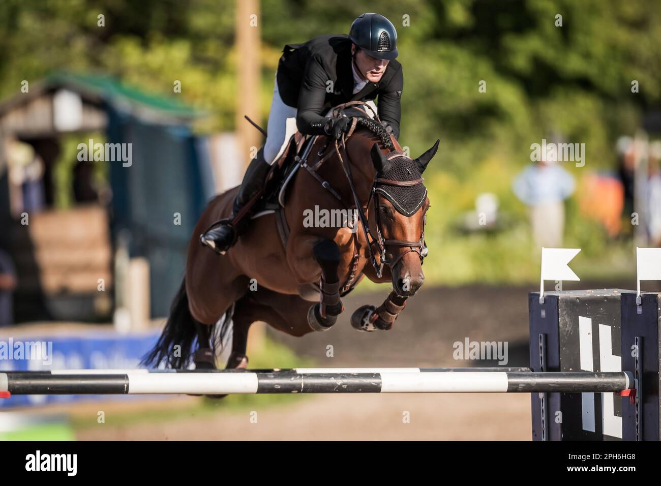 A professional rider competes during the 2022 Major League Show Jumping ...