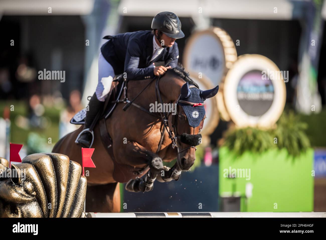 A professional rider competes during the 2022 Major League Show Jumping ...