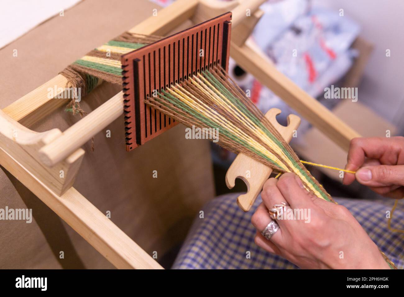Perm, Russia - February 22, 2023: incle band weaving process on a ...