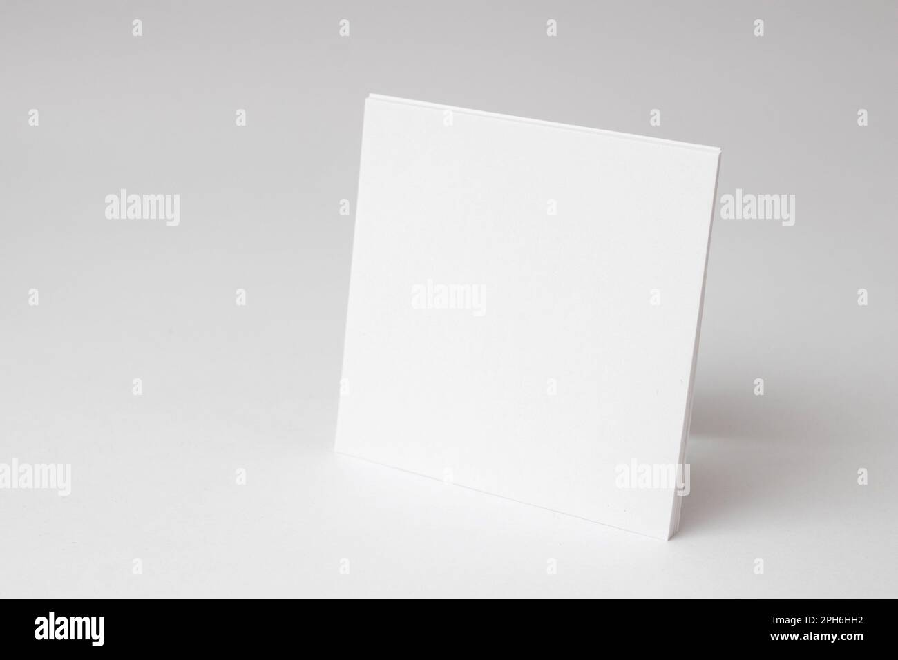 A blank square white empty paper on white background Stock Photo - Alamy