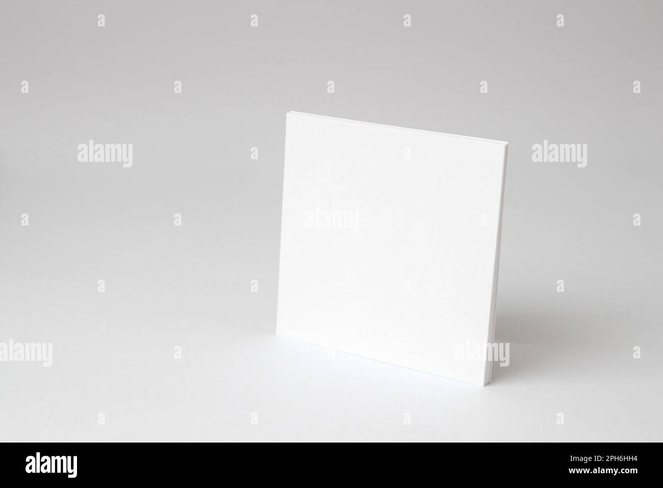 A blank square white empty paper on white background Stock Photo - Alamy