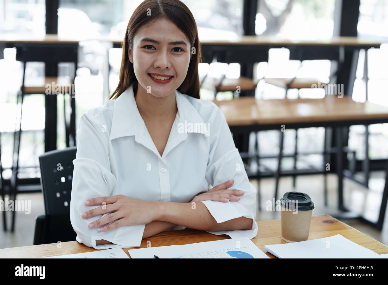 Portrait of a female business owner showing a happy smiling face as he ...