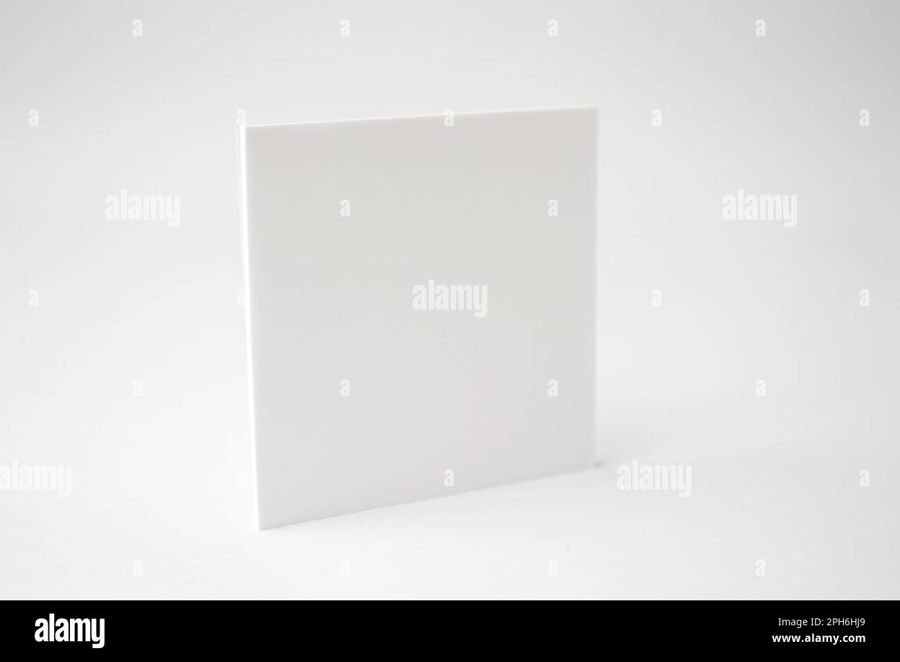 A blank square white empty paper on white background Stock Photo - Alamy