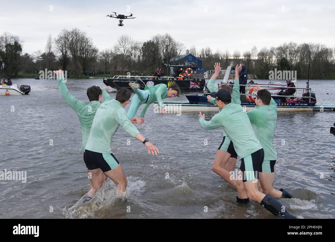 Cambridge men's cox Jasper Parish is thrown into the river after the ...