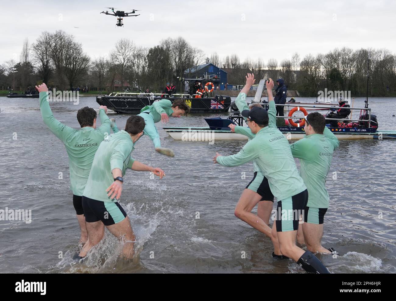 Cambridge men's cox Jasper Parish is thrown into the river after the ...