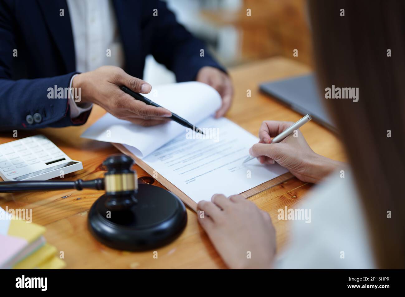 Law and legitimacy, portrait of lawyer and client signing important ...
