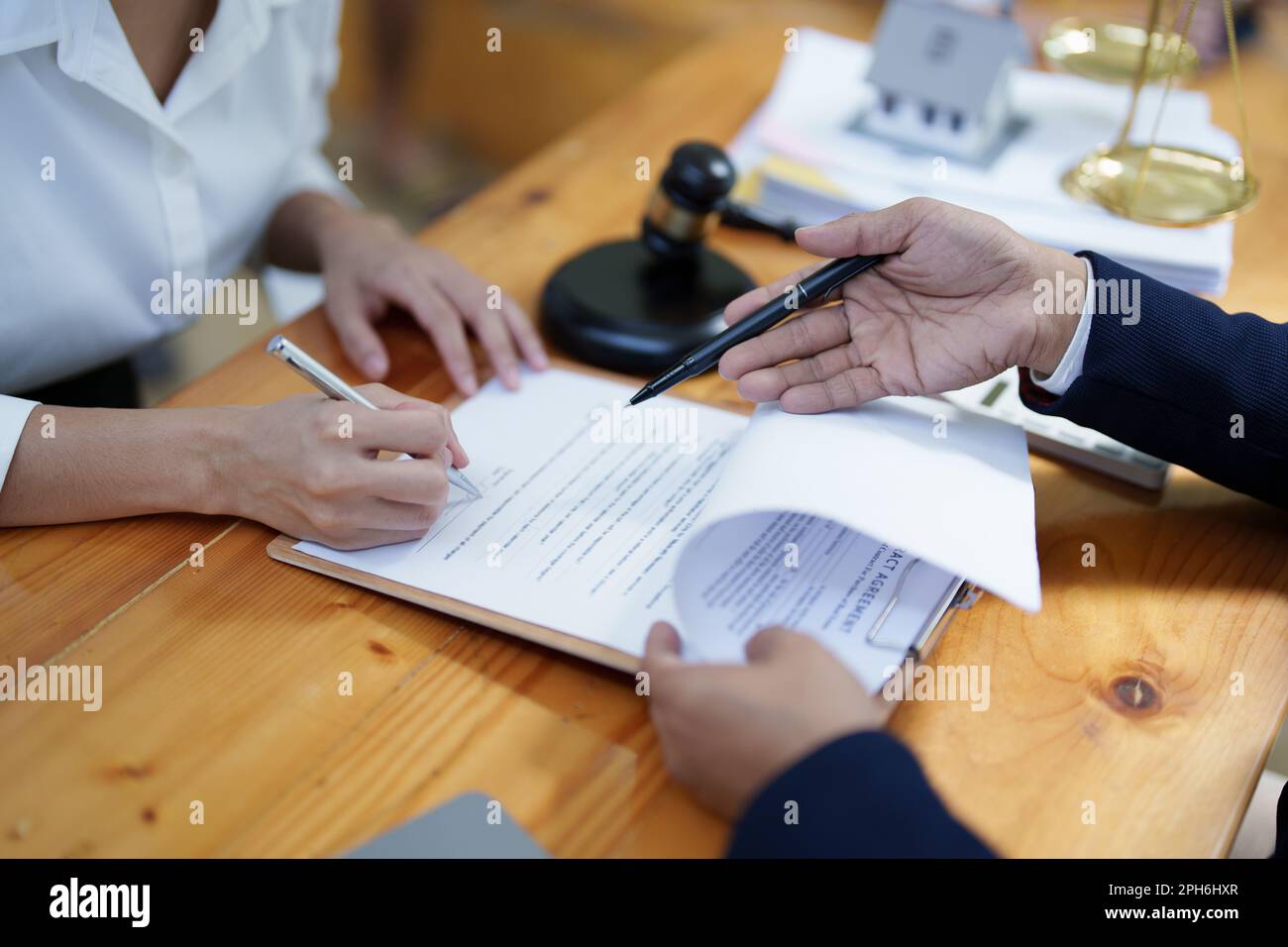 Law and legitimacy, portrait of lawyer and client signing important ...