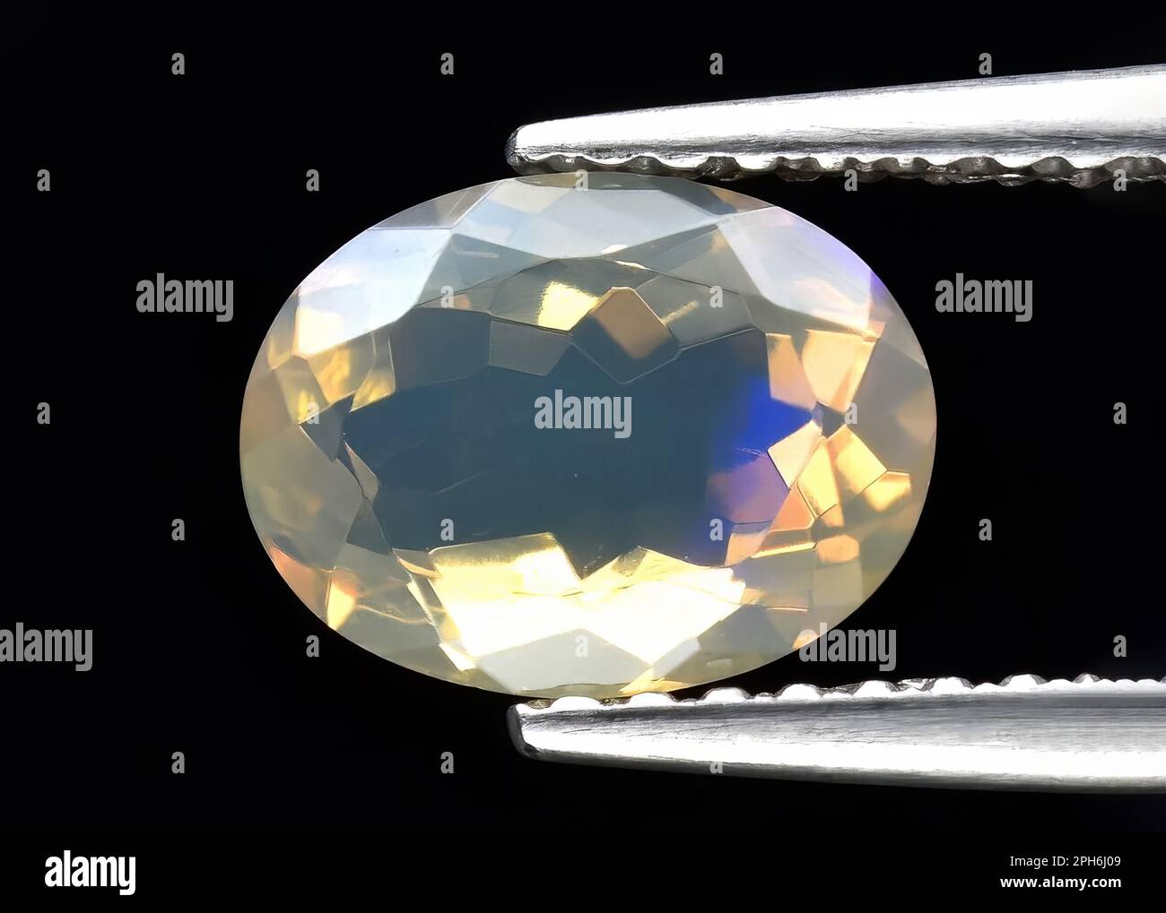 Natural precious stone noble opal on black background Stock Photo - Alamy