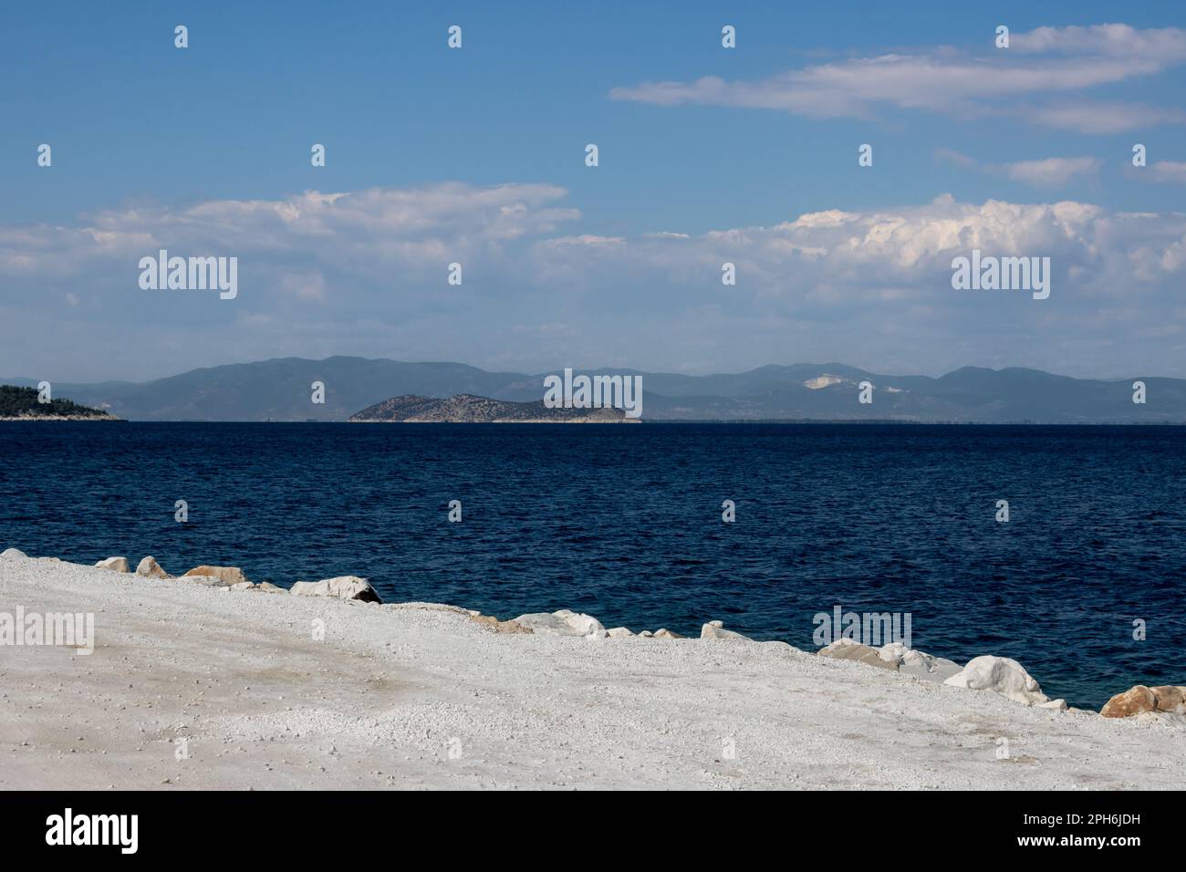 White marble lining the coast of Thracian sea. Marble beach in white ...