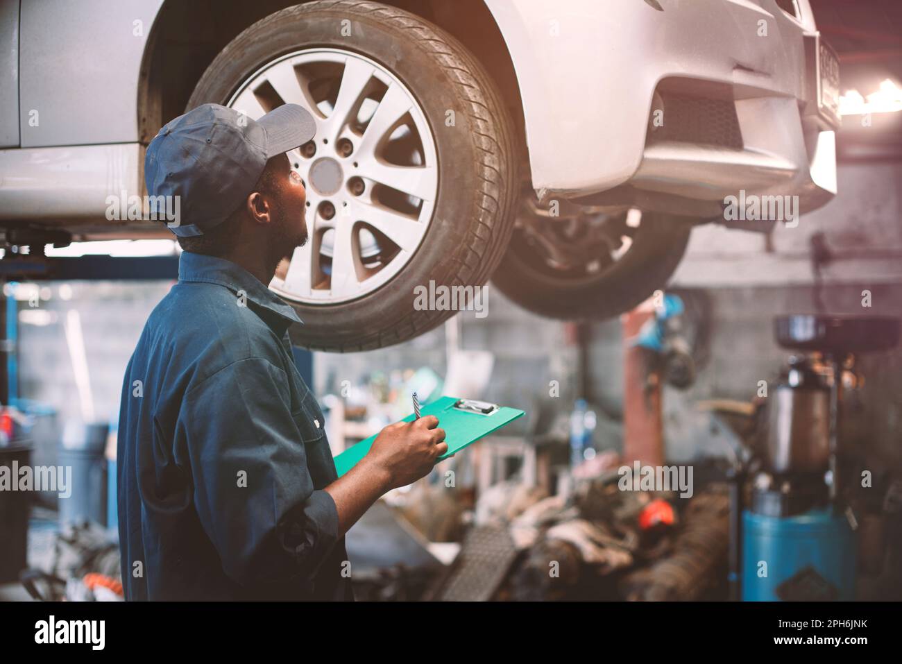 Car service mechanic checks wheel hi-res stock photography and images ...