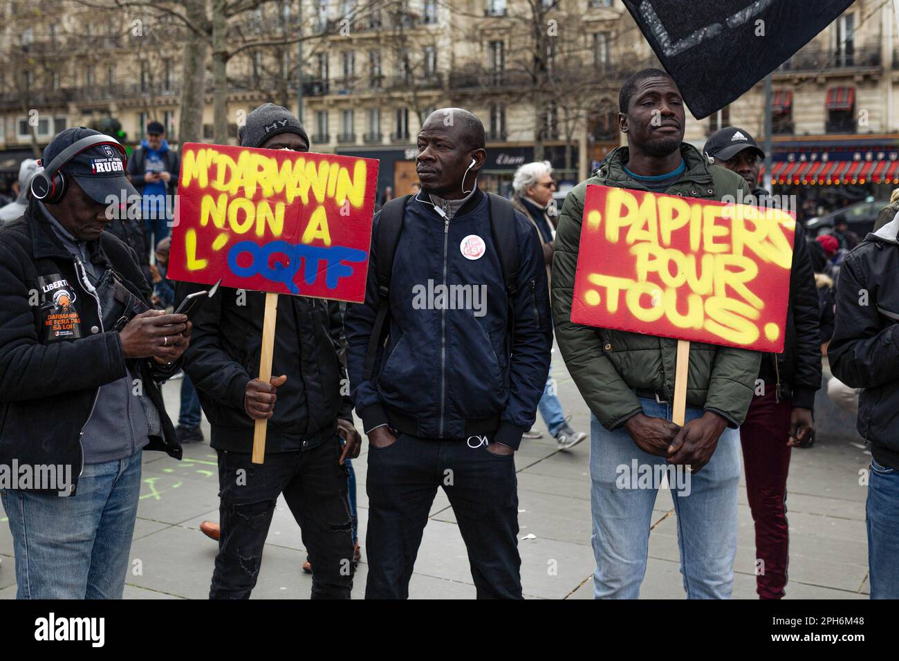 Paris, France. 25th Mar, 2023. Protesters hold placards expressing ...