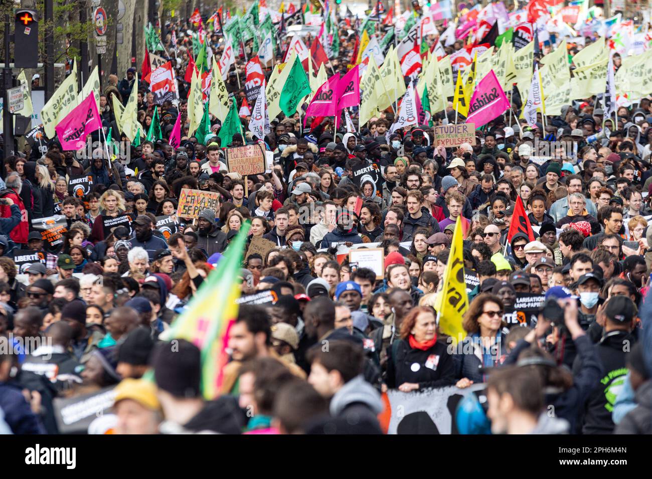 Paris, France. 25th Mar, 2023. A huge crowd of protesters with flags ...